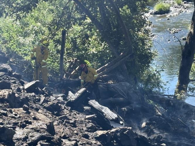 Flood debris catches fire near river | Local News | nrtoday.com