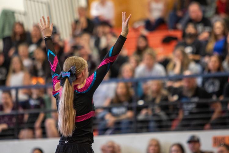 Tumbling, cheering and dancing through the Orange and Black Cheer ...