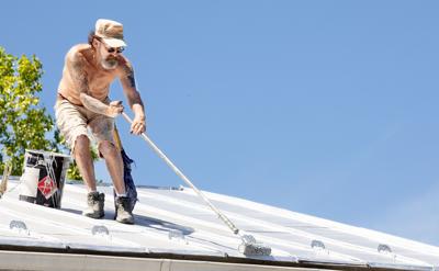 Painting The Roof | Featured Stand Alone Photo | nvdaily.com