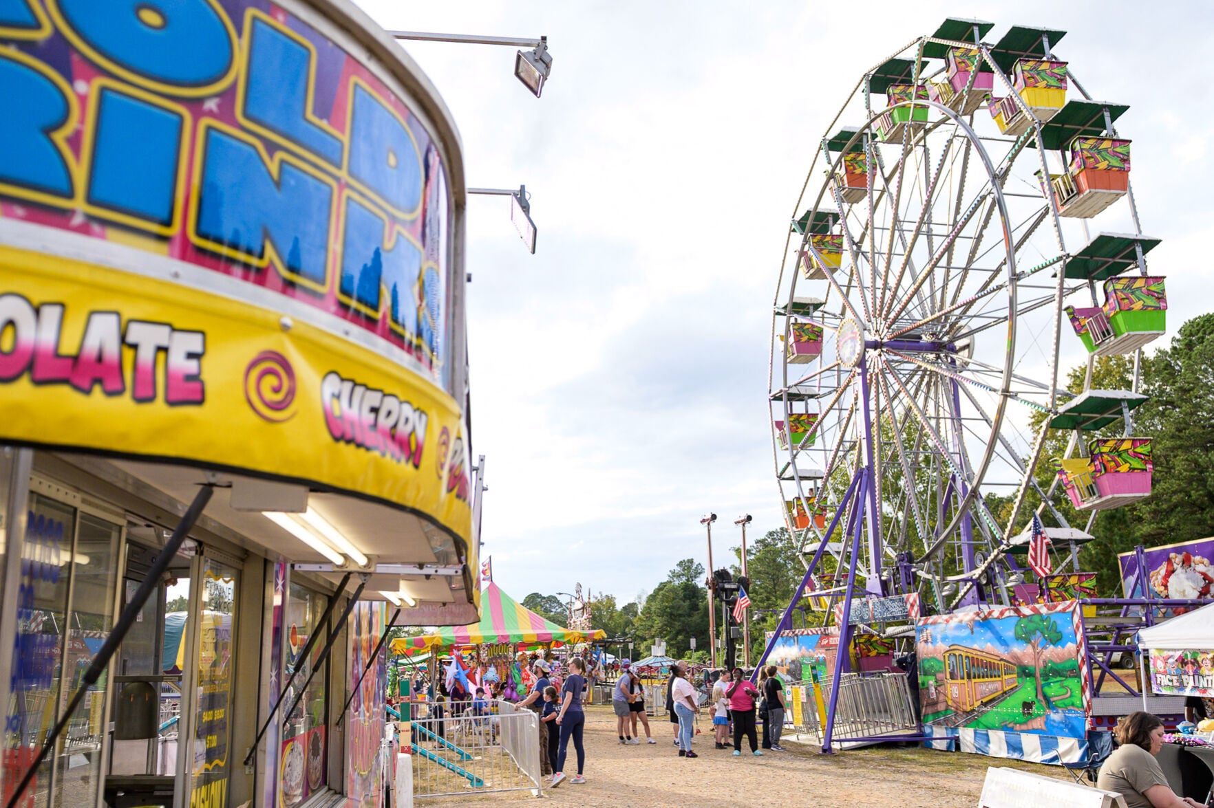 Guests enjoy games, rides, and food at the Lee County Fair
