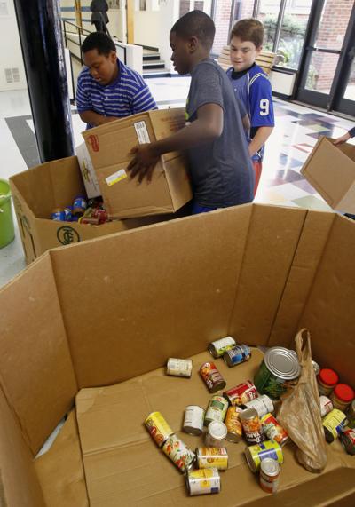 Drake Middle School students working hard to beat Bama in food drive