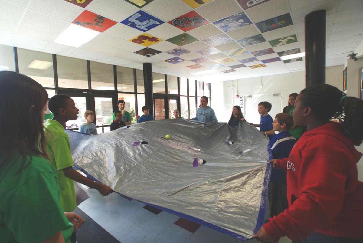 Students at Auburn's Drake Middle School learn about money at Financial ...