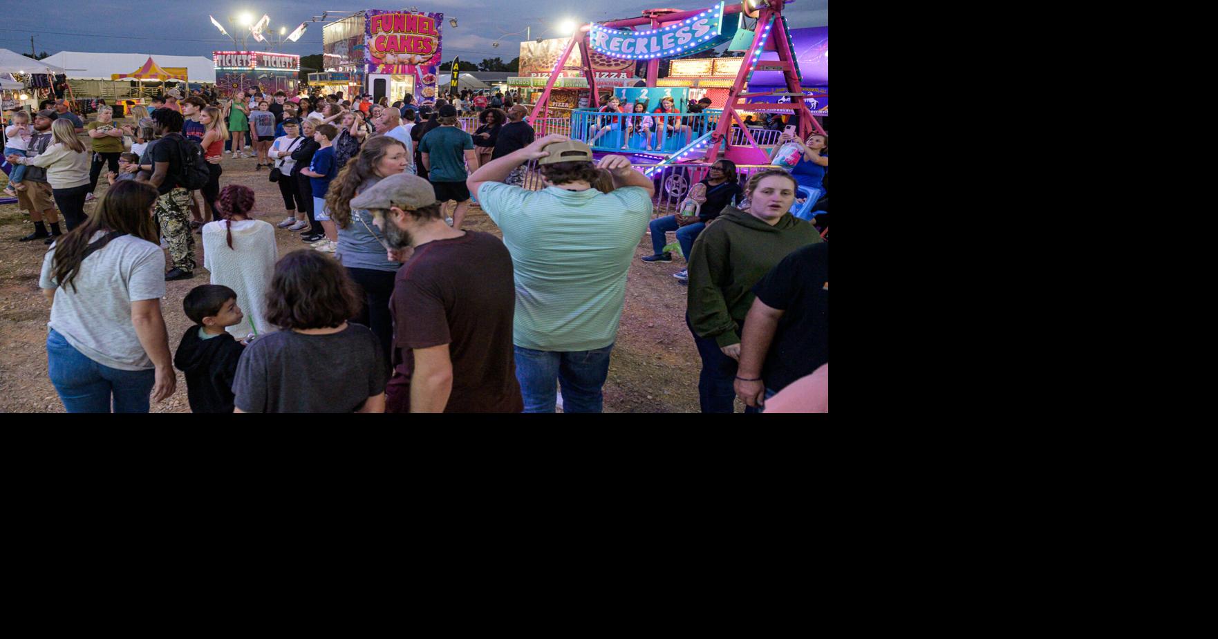 Guests enjoy games, rides, and food at the Lee County Fair