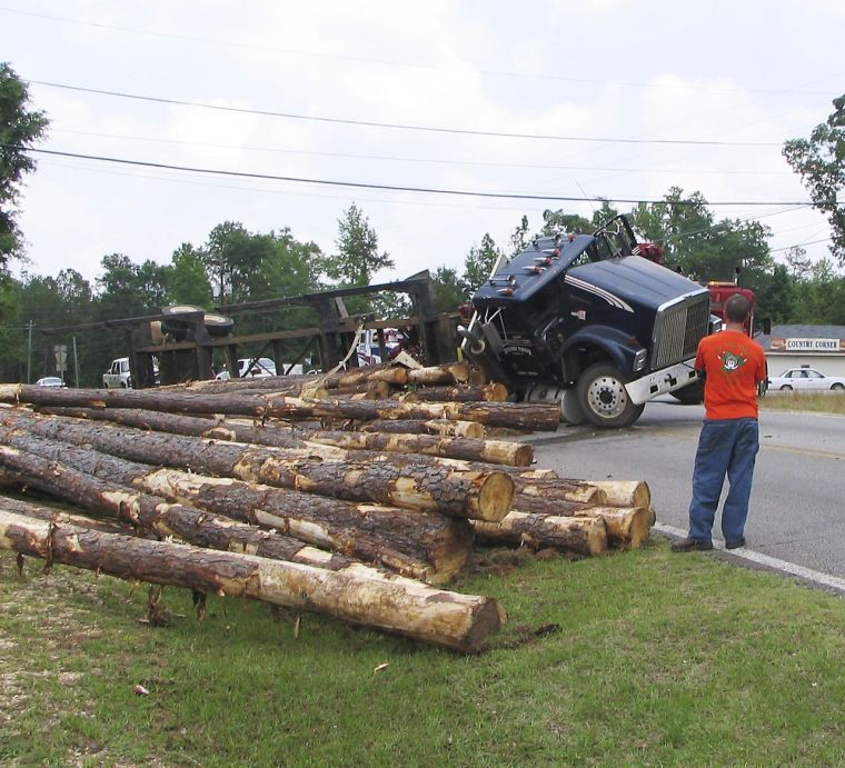 Logging truck overturns, no fatalities