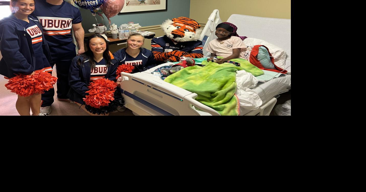 Aubie, Auburn cheerleaders visit kids at Piedmont