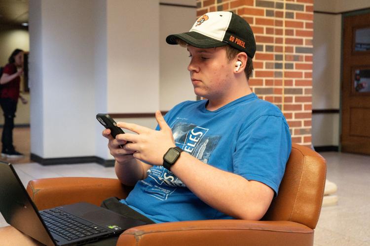 Gallery: Students Scrolling on Their Phones | | ocolly.com