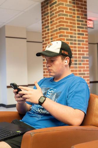 Gallery: Students Scrolling on Their Phones | | ocolly.com
