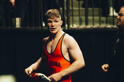 'Staying alive': Cowboys grind through day 1 of NCAA Wrestling ...
