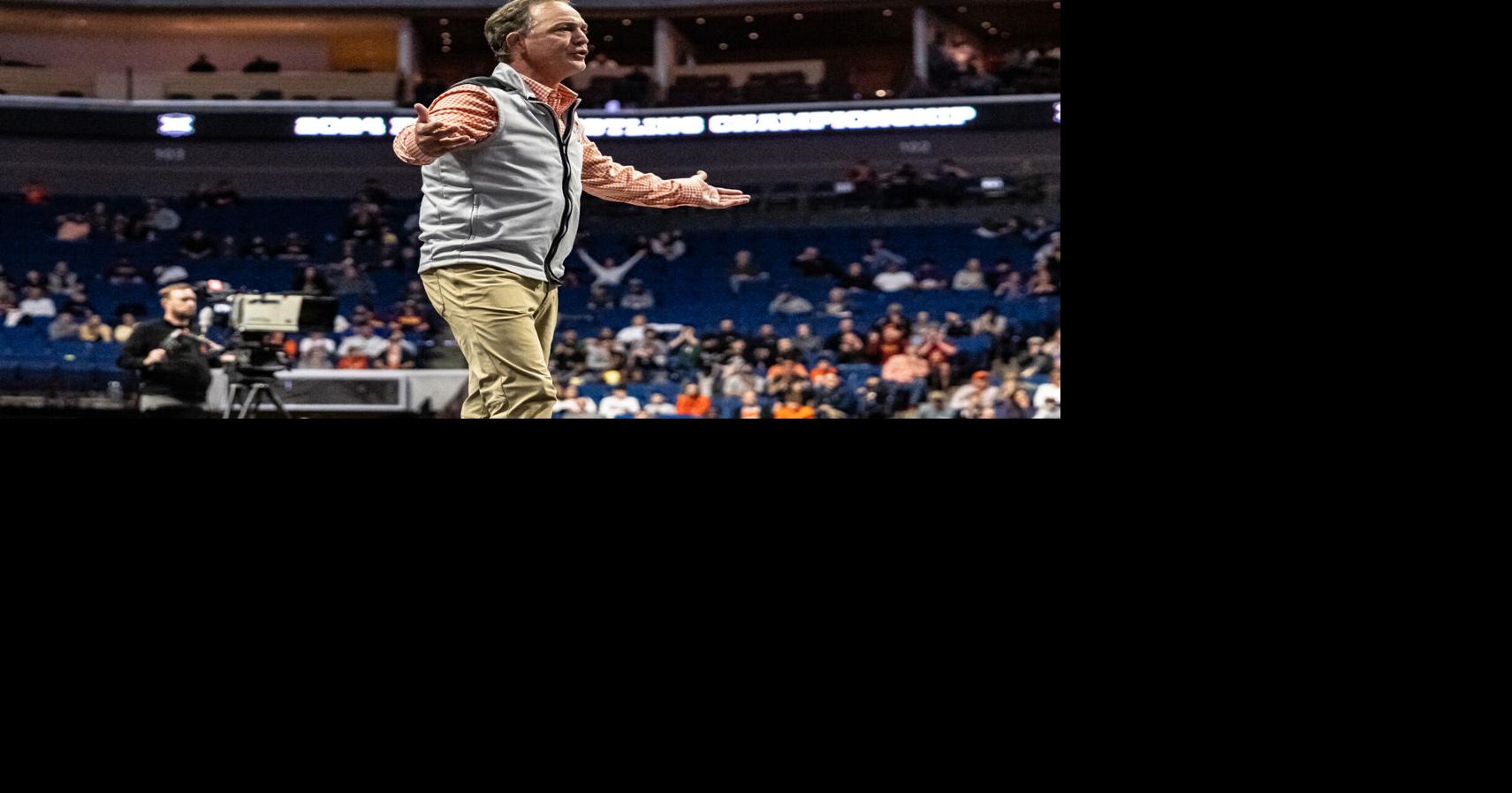 Wrestling Coach John Smith | | ocolly.com