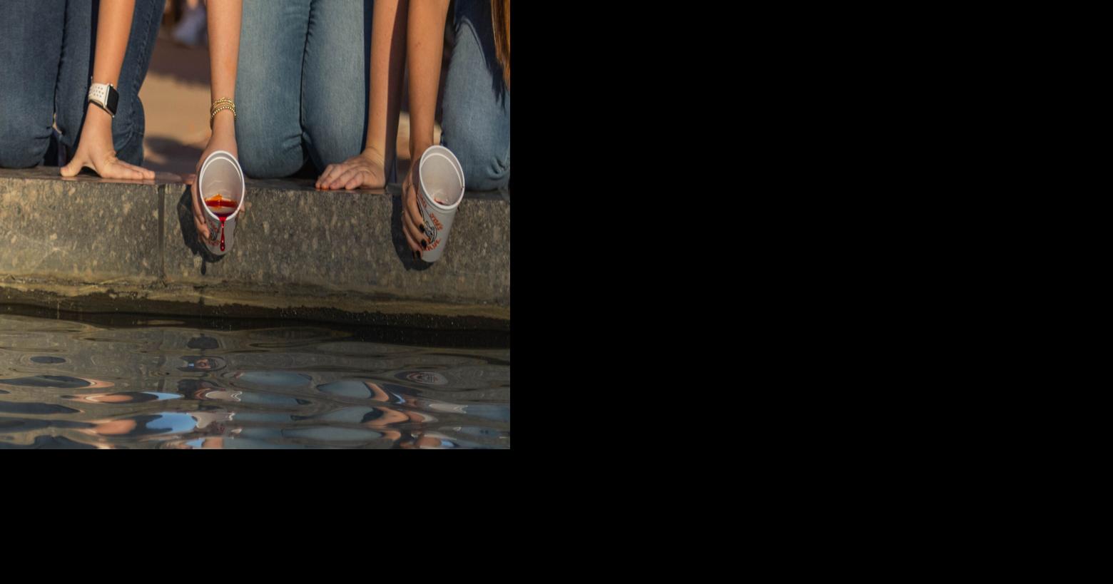 Color it orange: Fountain dyeing outside Edmon Low library kicks off ...