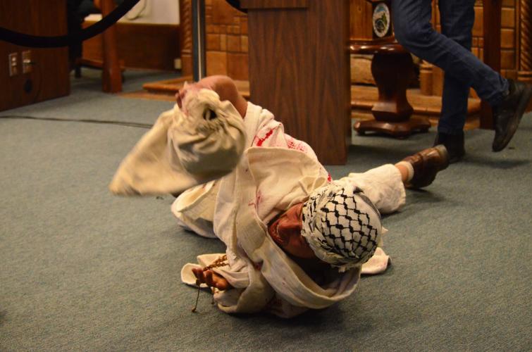 lying prostrate on the ground