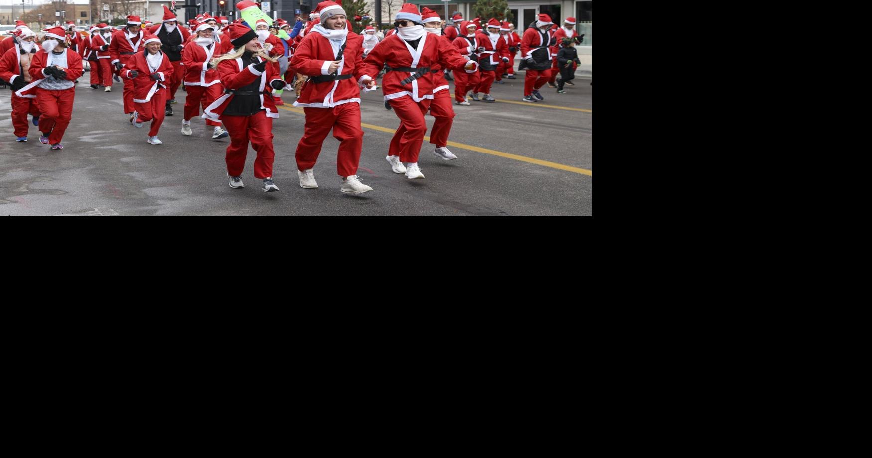 Holiday-themed fun run brings crowd of Santas to Omaha's Blackstone ...