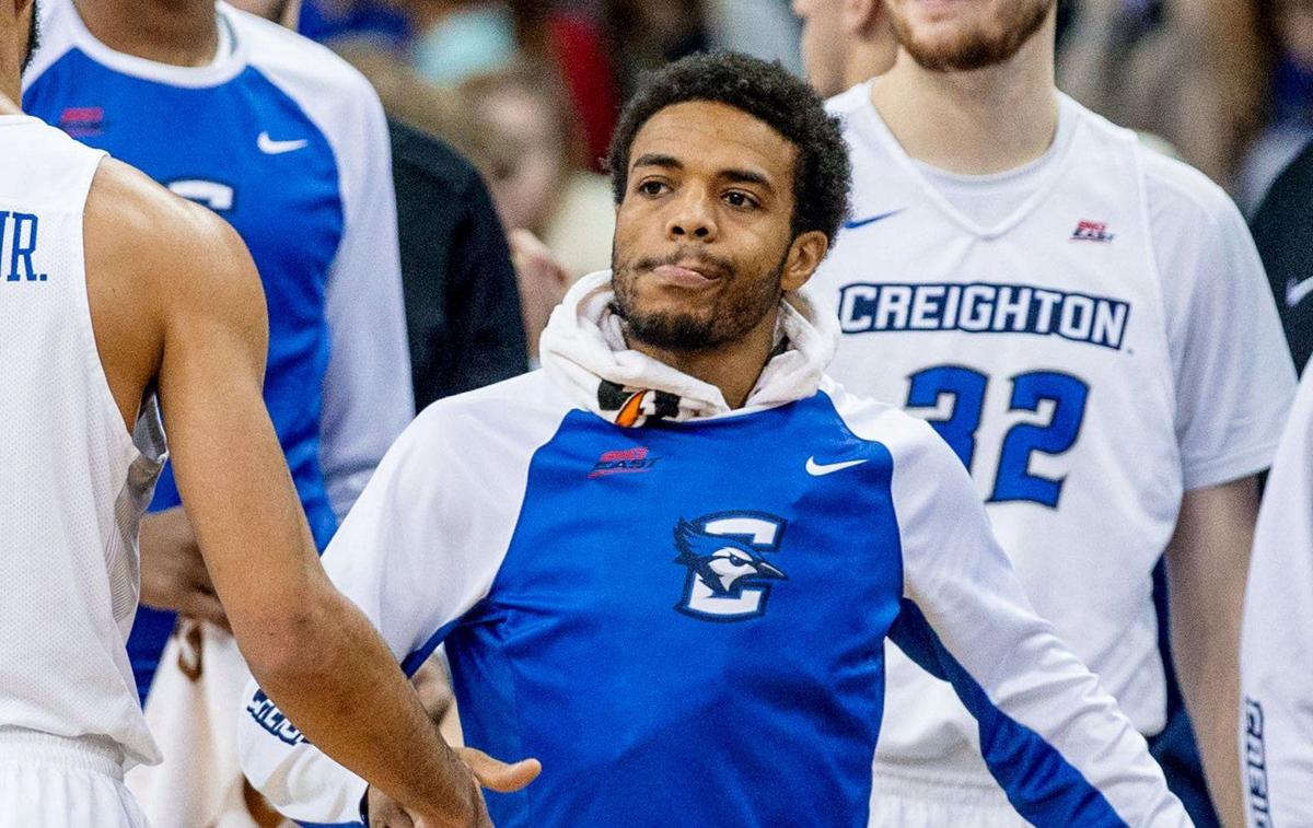 Creighton point guard Mo Watson carried off the court during first half ...