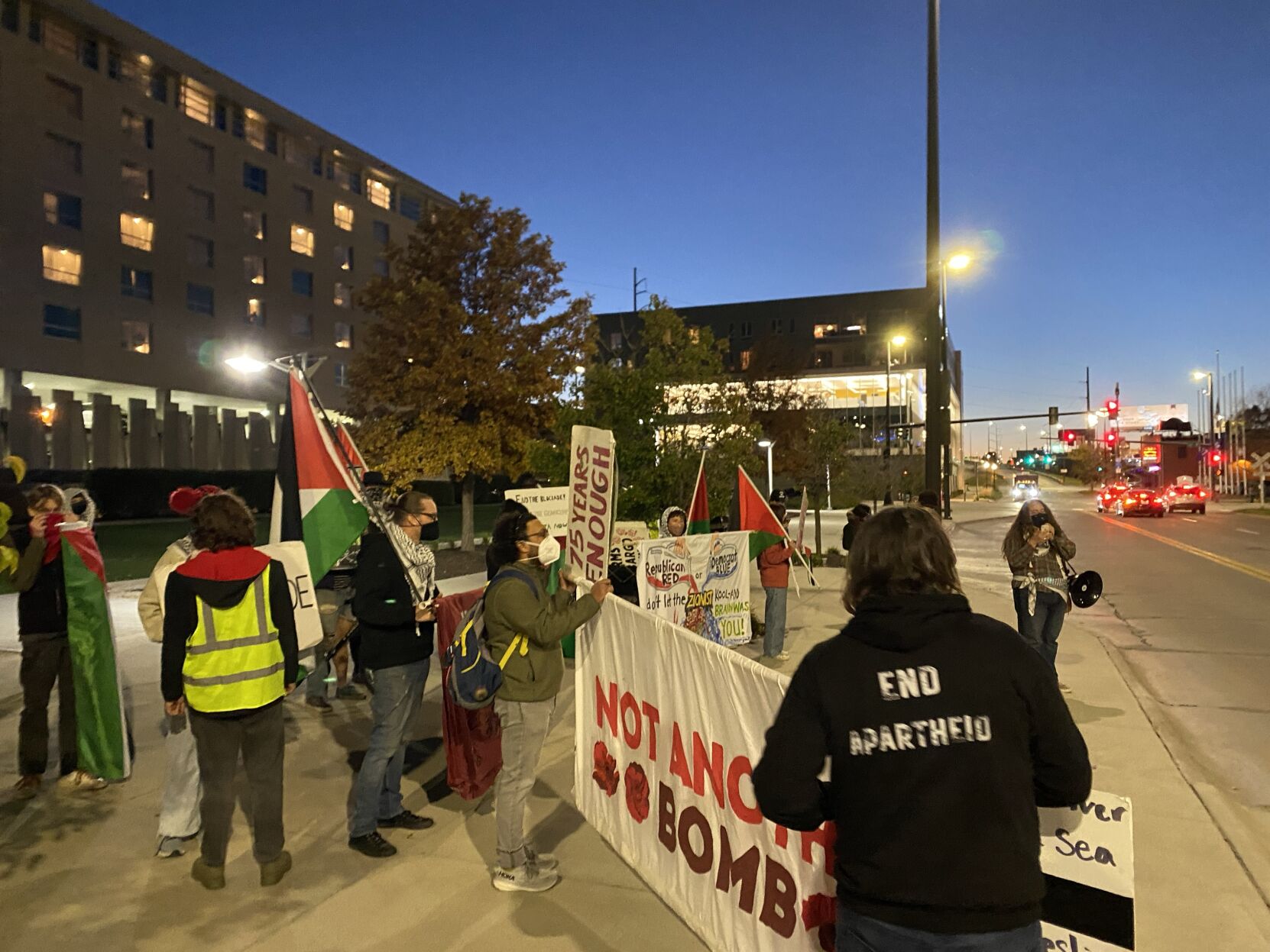 Dignitaries, protesters gather outside ahead of Joe Biden visit