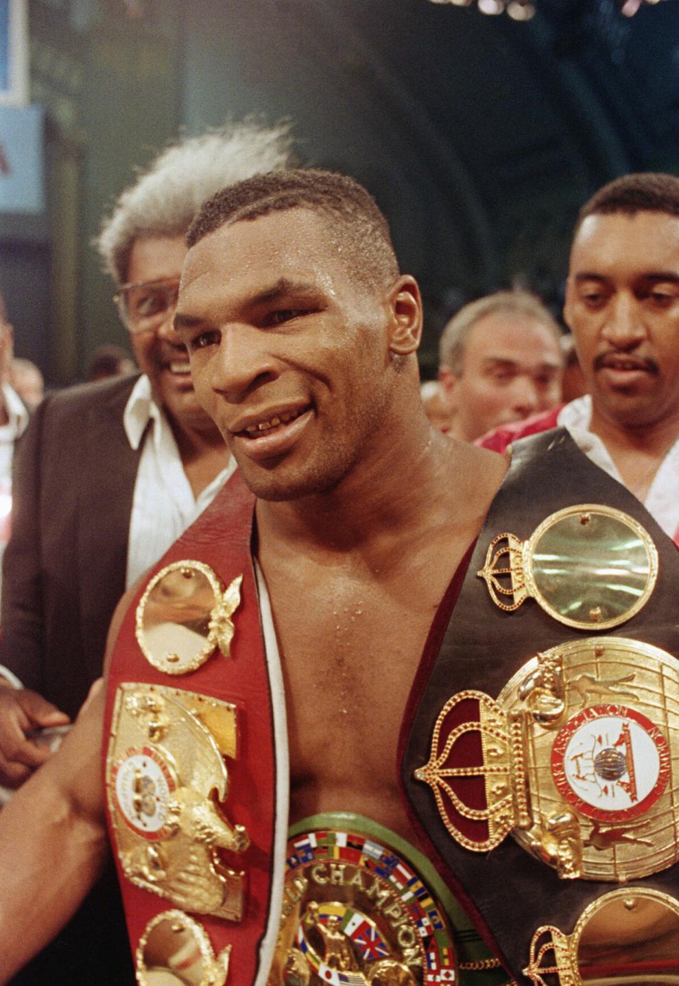 Today in sports history: Mike Tyson takes 93 seconds to defend title in ...