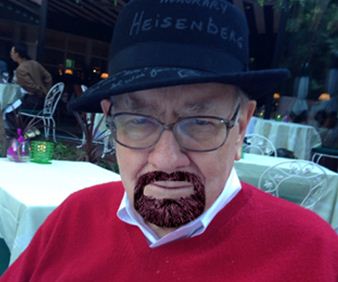 Let's look at this photo of Warren Buffett dressed as Heisenberg
