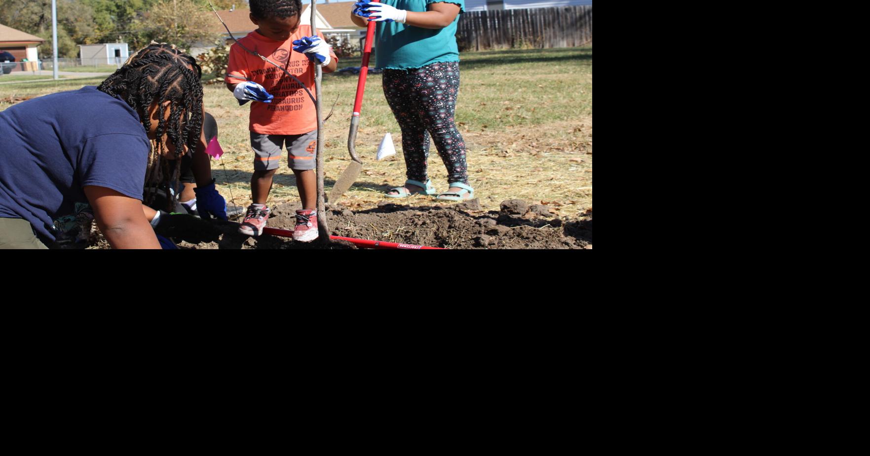 Volunteers plant 175 trees along the North Omaha Trail