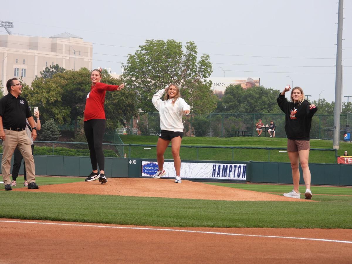 Nebraska volleyball players throw first pitch at Lincoln Saltdogs game