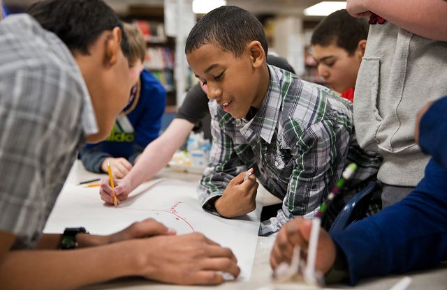 To encourage boys' reading, look to book clubs