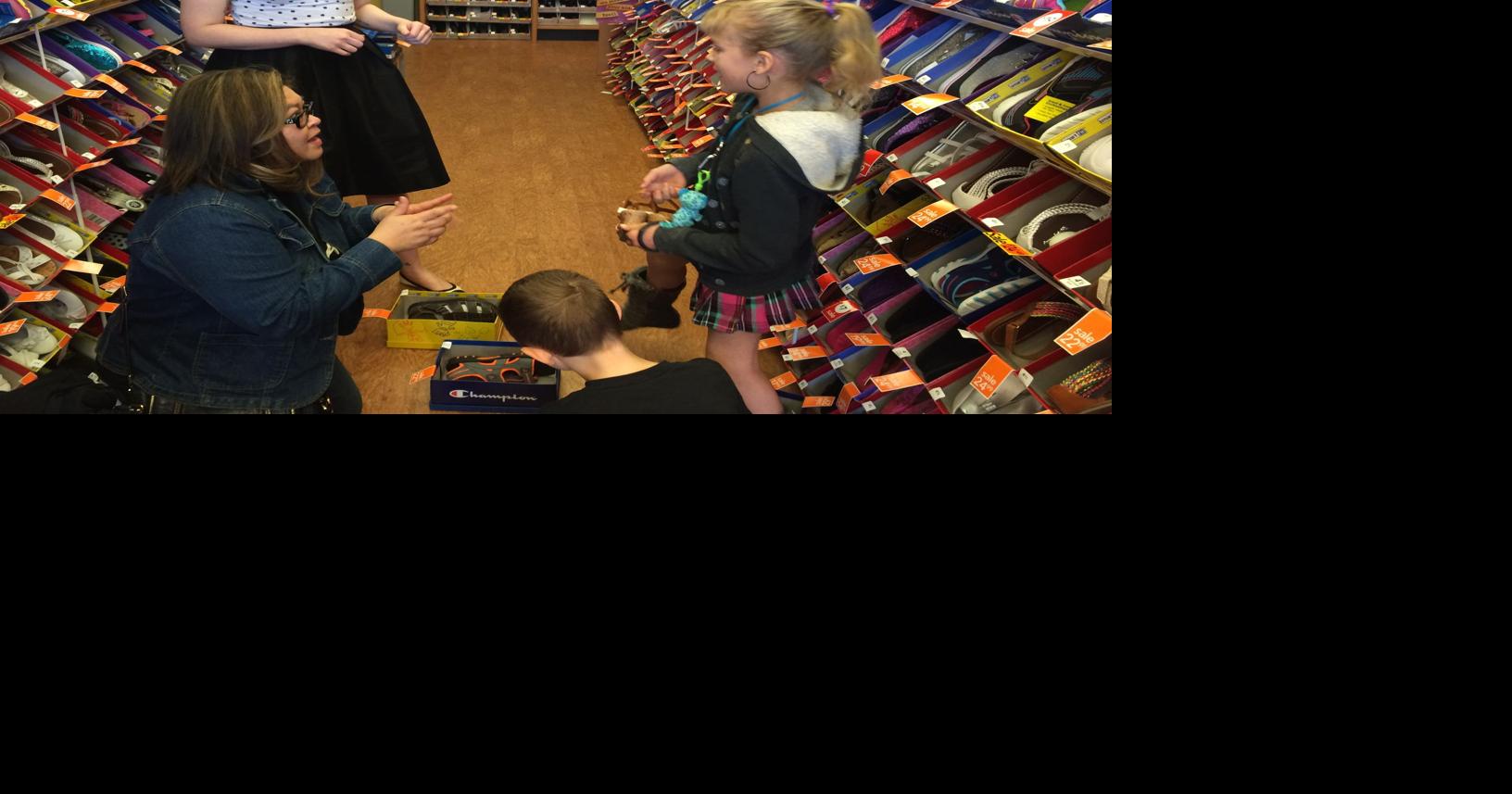 Payless donation means happy feet for 50 local homeless children