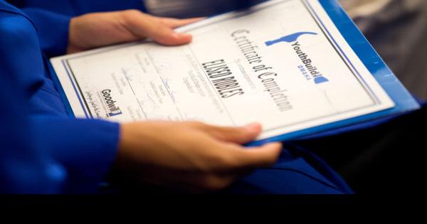 Proud parents, students at graduation for Goodwill job-training program