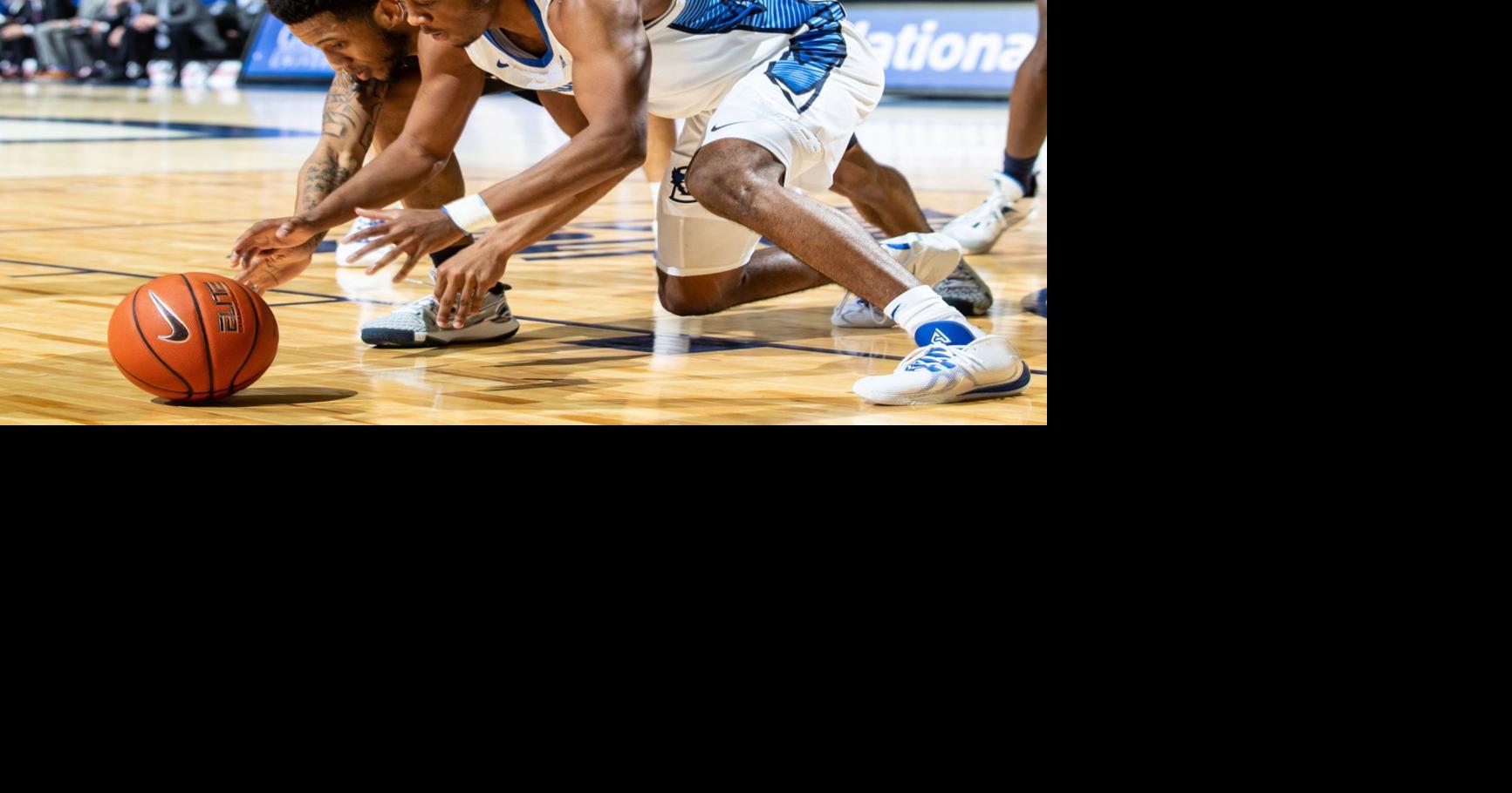 Creighton's Shereef Mitchell and Antwann Jones push each other toward ...