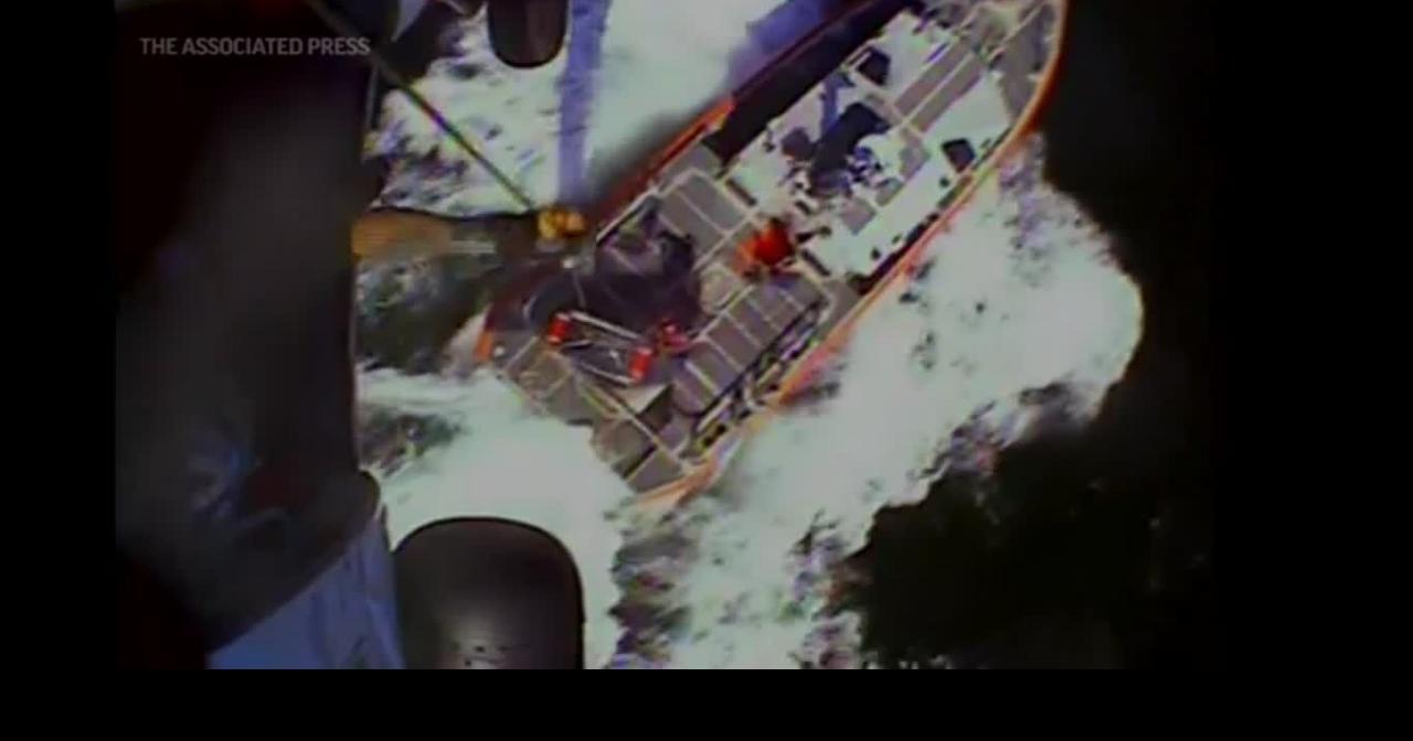 2 from sunken boat fend off sharks during rescue