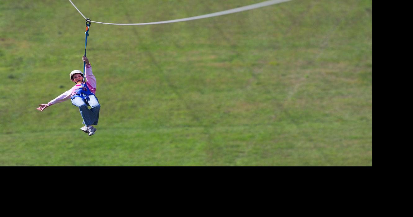 Scary or fun? Scenes from the so-called longest zip line in Iowa and ...