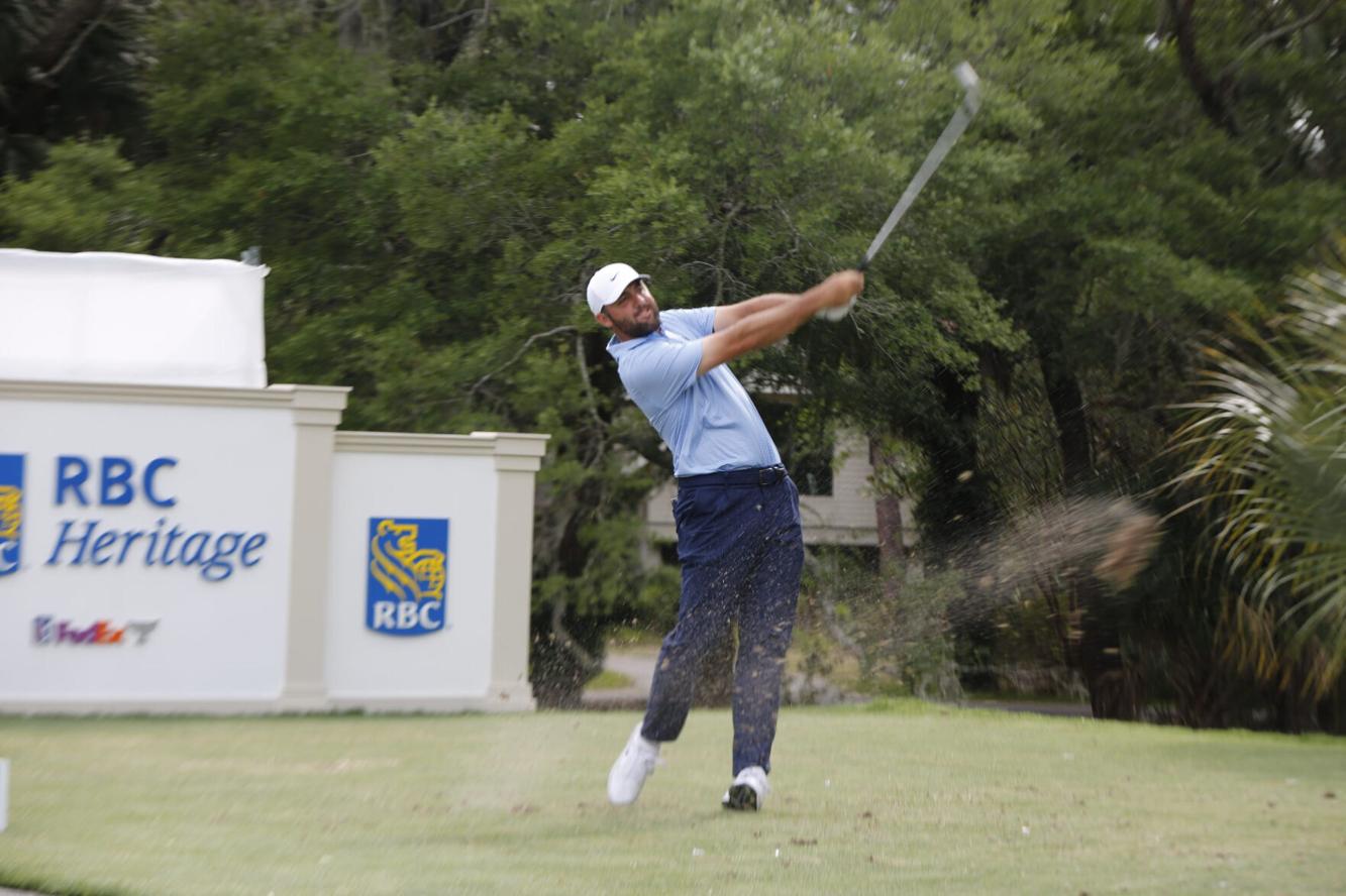 Scottie Scheffler follows through on his tee shot on the 14th hole of ...