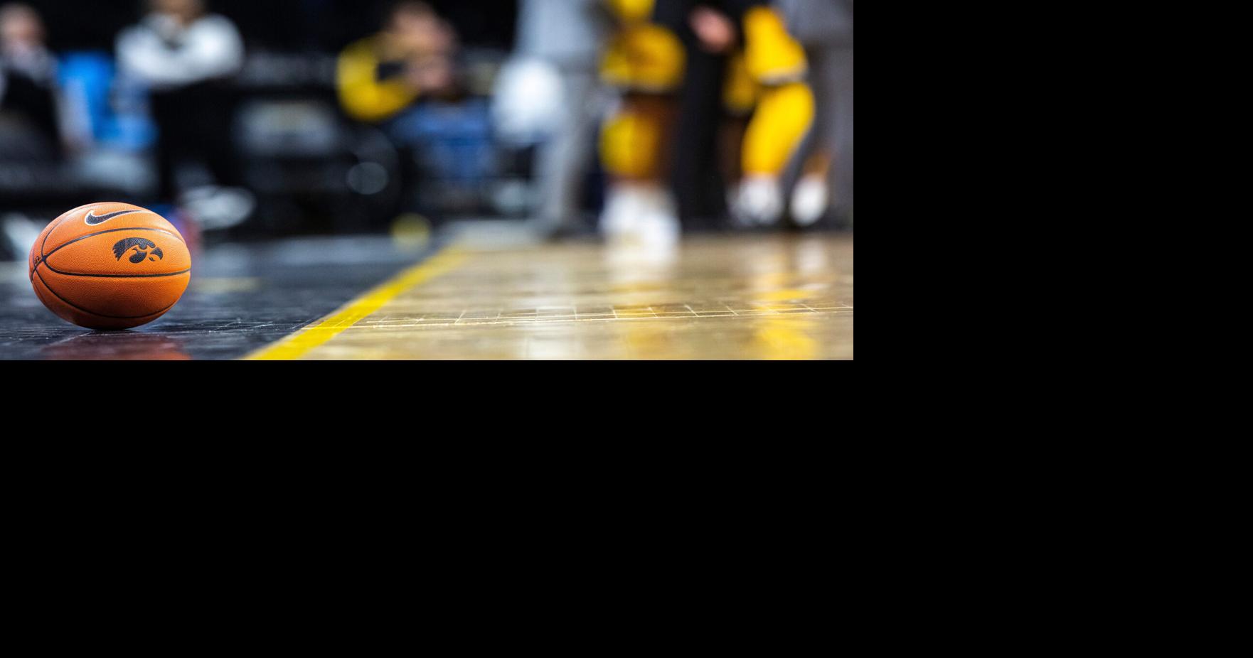 An Iowa basketball with a Tigerhawk logo rests along the baseline ...