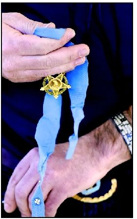 Tarnished medal, humble soldier