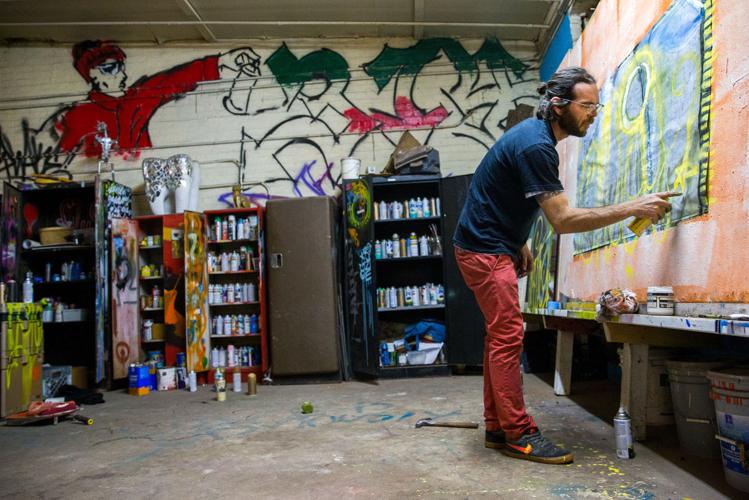 Omaha artists painting over graffiti with graffiti