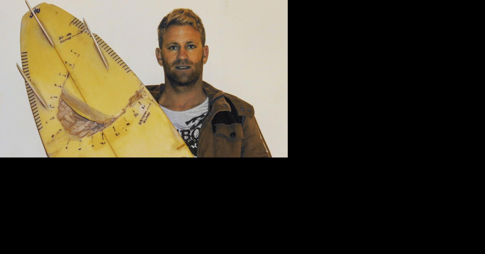 Surfer attacked by two sharks paddled to safety with one hand ...