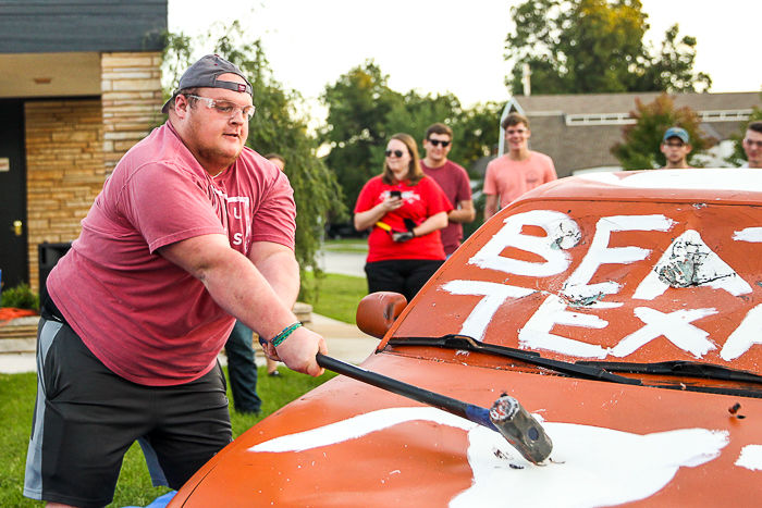 Destroying the "Beat Texas" car before Red River Showdown (photos ...