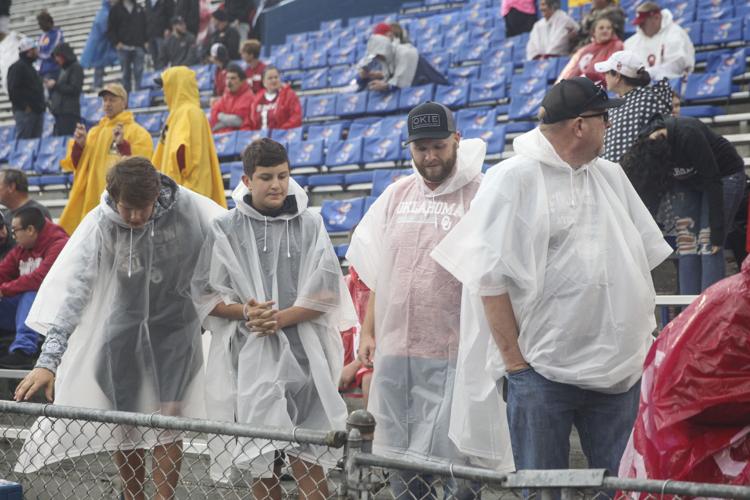OU football: Sooner fans wait during weather delay in Lawrence, Kansas ...