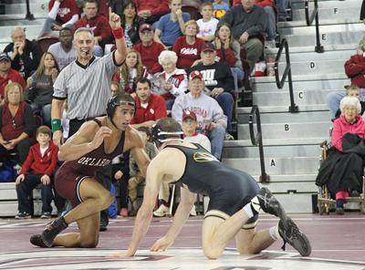Wrestling grabs two individual titles, finishes third at Big 12 ...