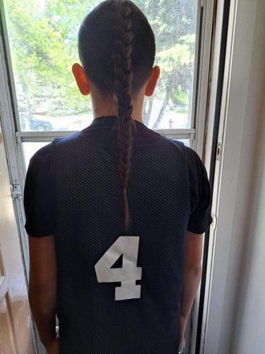 Basketball players told to put long hair in jerseys, ref facing ...
