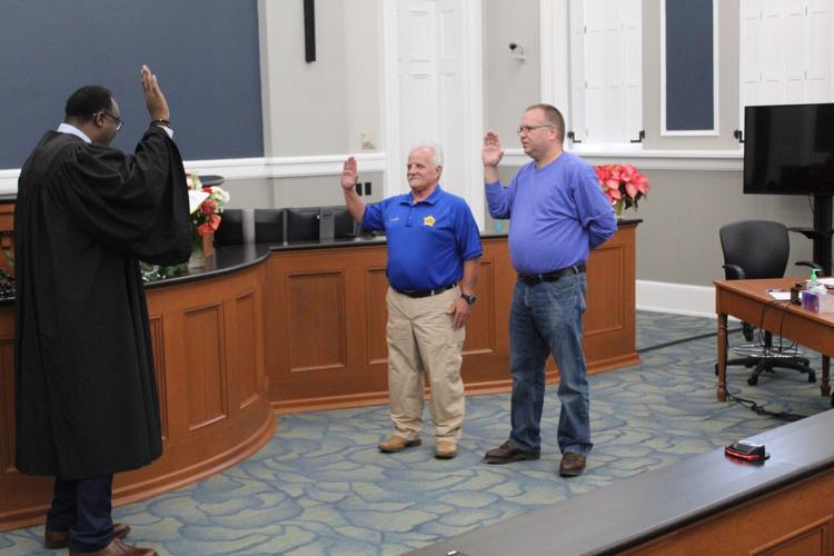 Coroner Mike Paris and his deputies were sworn into office by Judge ...