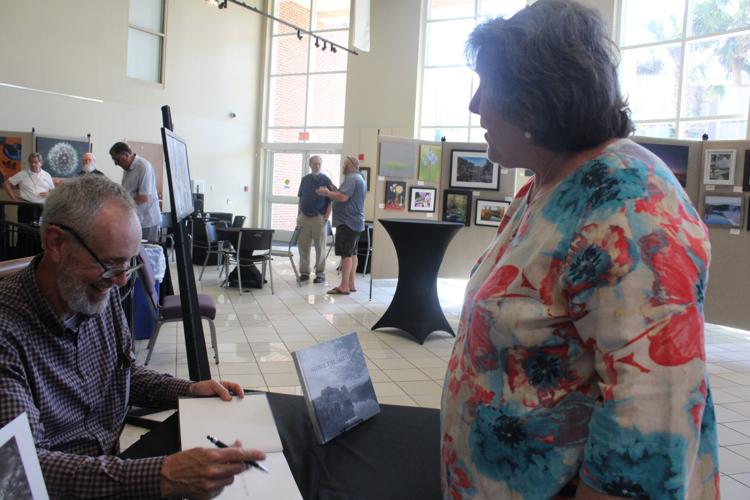 Photography reception features local photos and book signing