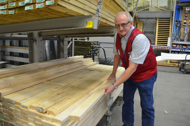 Learning skills for the 11th build: Lowe's employee teaches Habitat ...