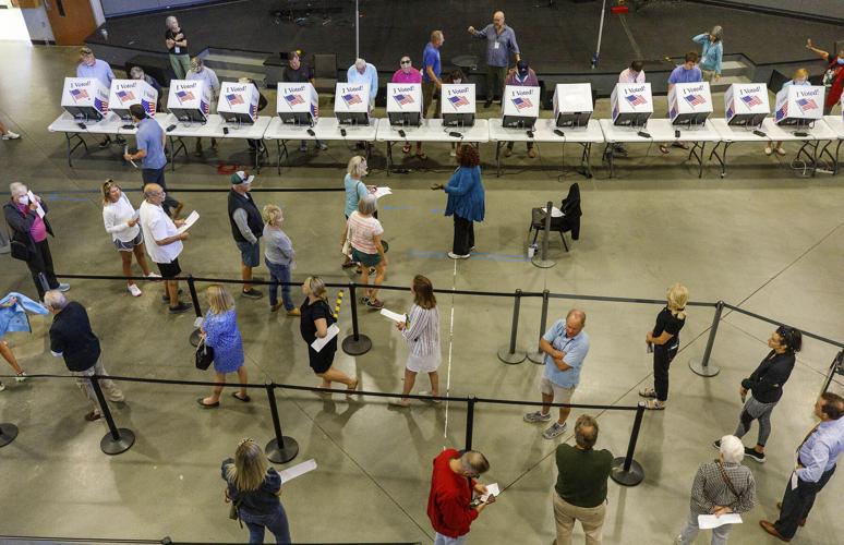 Huge early voting turnout should ease pain at polls. Here's what to ...