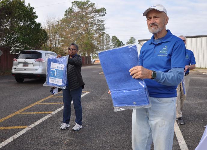 First tarp giveaway event generates enthusiastic response | News ...