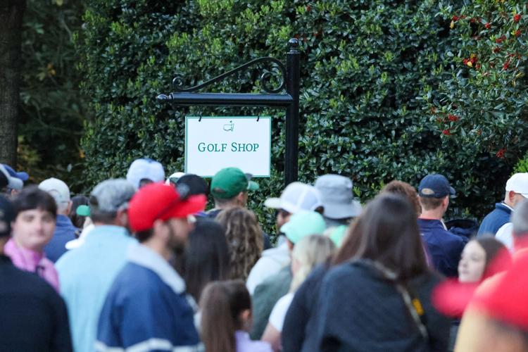 Fans buy merchandise at Augusta National before Masters