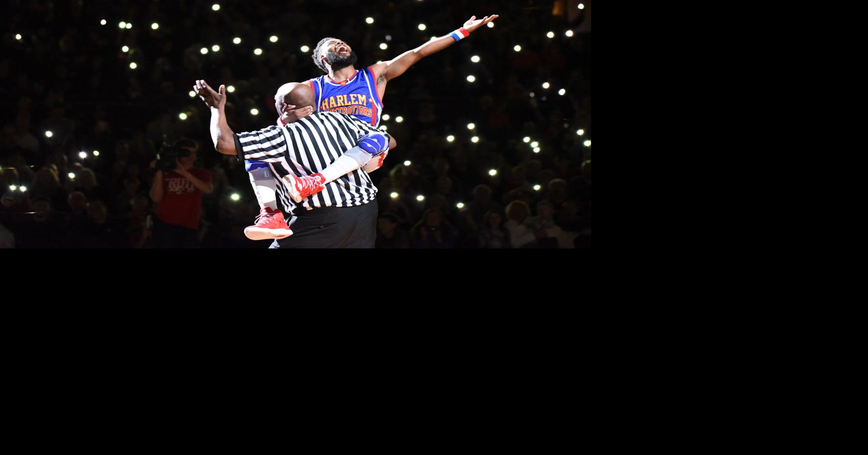 Basketball stunt artists Harlem Globetrotters dunking at North ...