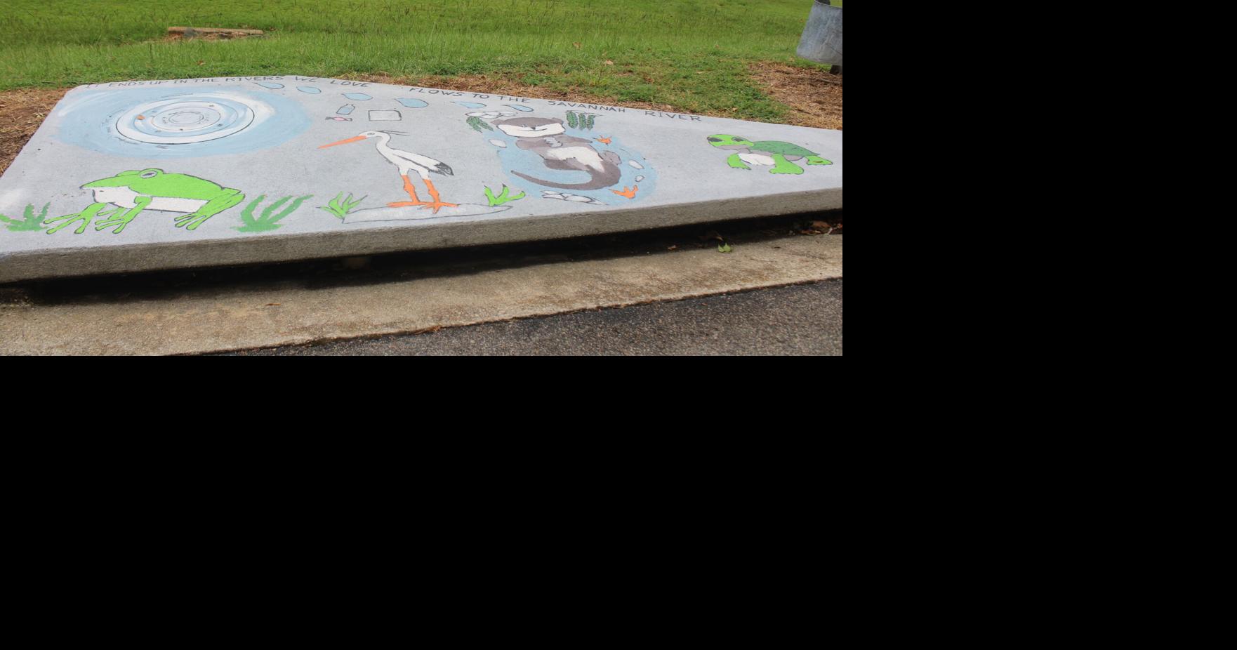 Kid-painted murals show effects of pollution on waterways