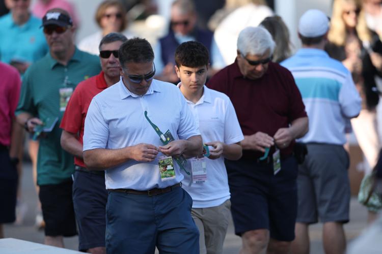 Masters gives viewing glasses to patrons for solar eclipse