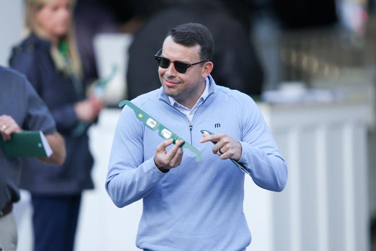 Masters gives viewing glasses to patrons for solar eclipse