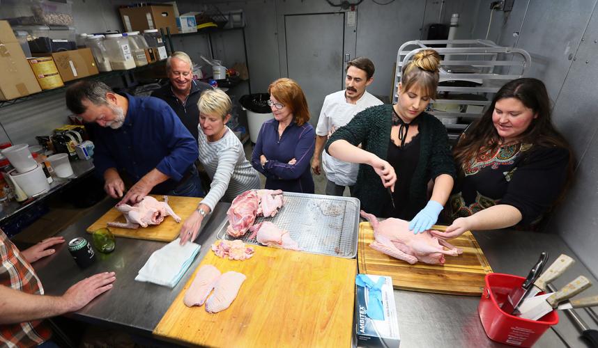 Chef and farmer teach Charleston cooking class students to butcher and ...