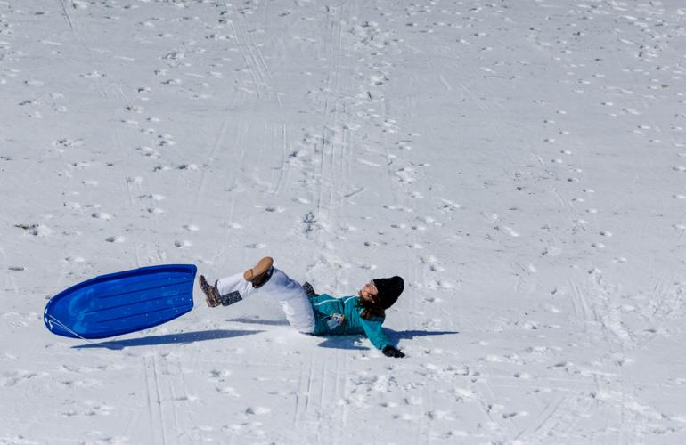 Photos: Sleds and skis on a snowy Mount Pleasant