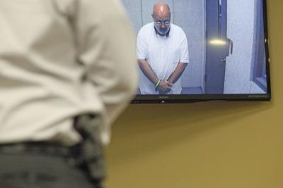 Doctor charged in deaths of 9 dogs